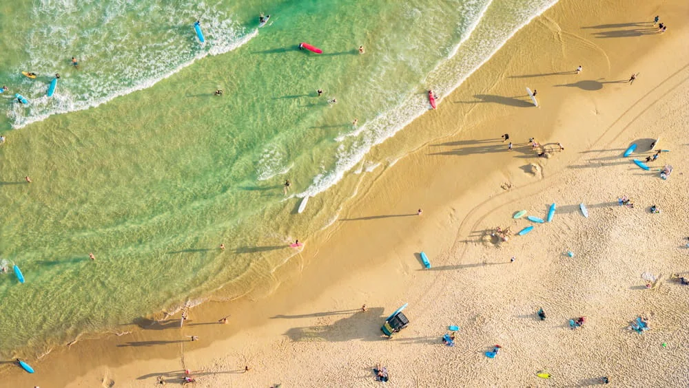 Bondi Beach Aerial View of Bondi Beach Shoreline with Surfers and Beachgoers