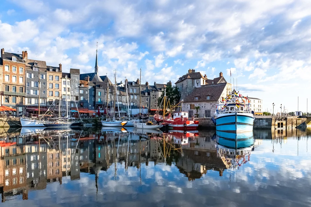 Honfleur's Harbor Honfleur, beautiful city in France, the harbor in the morning, reflection on the river