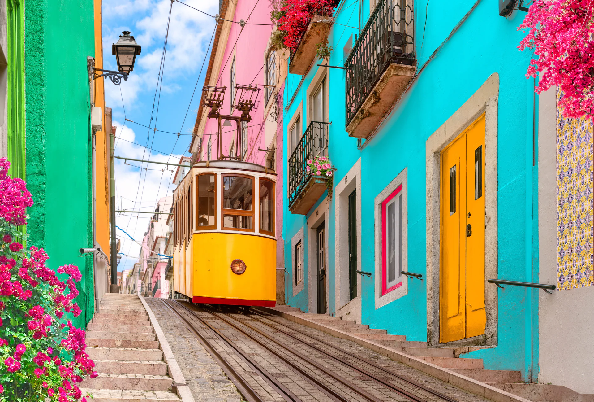 Lisbon Tram Lisbon Tram on Narrow street between colourful houses